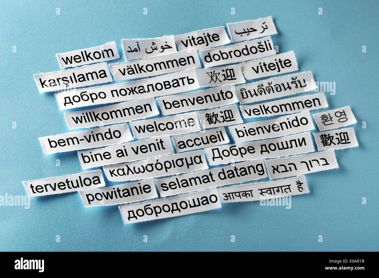 welcome Word Cloud printed on paper on blue Stock Photo - Alamy