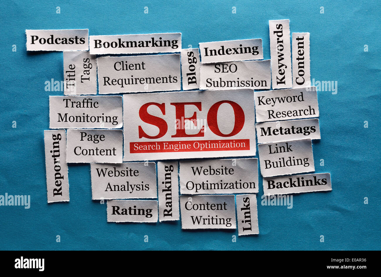 SEO Word Cloud printed on paper on blue font Stock Photo - Alamy