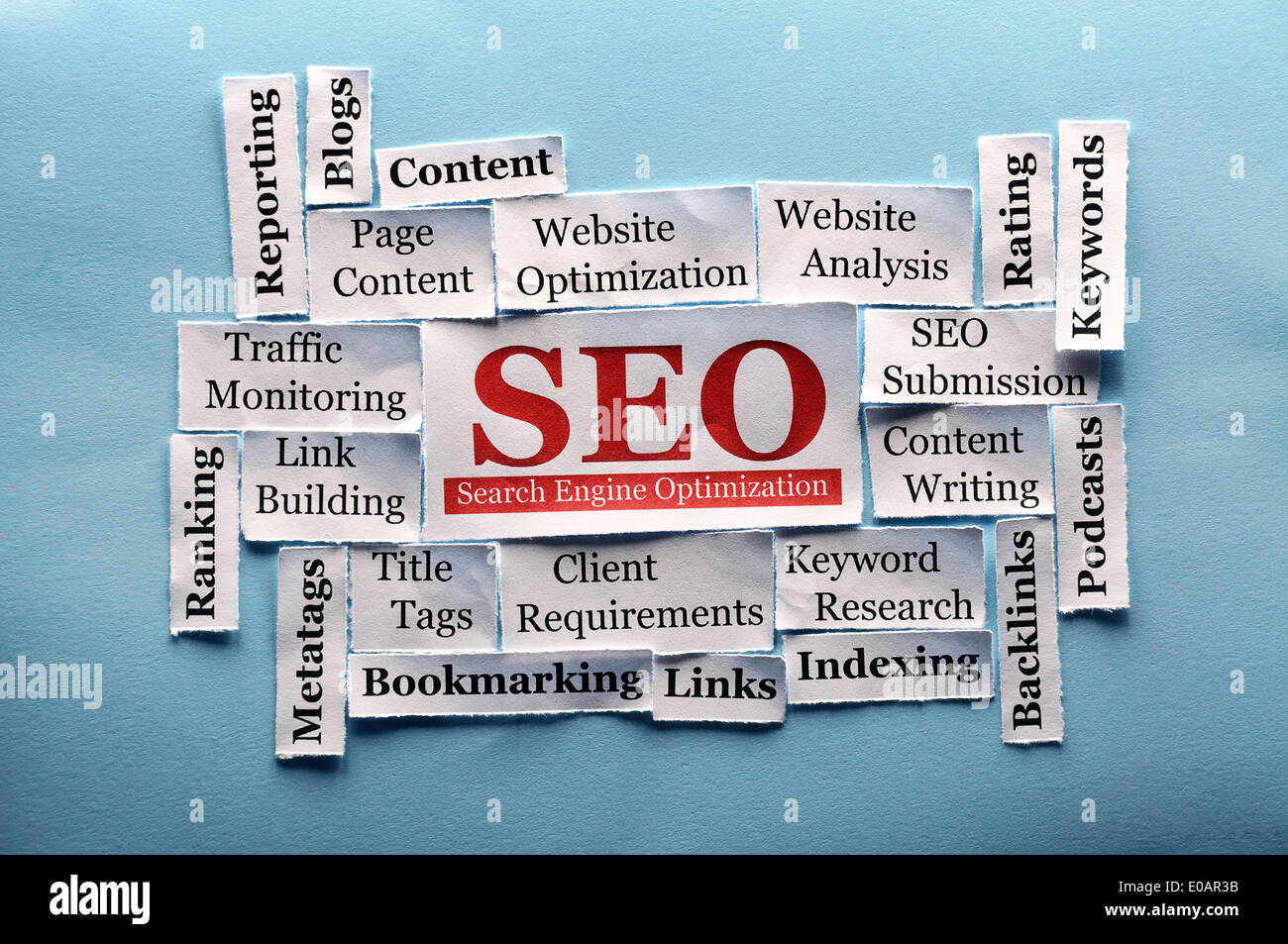 SEO Word Cloud printed on paper on blue font Stock Photo - Alamy