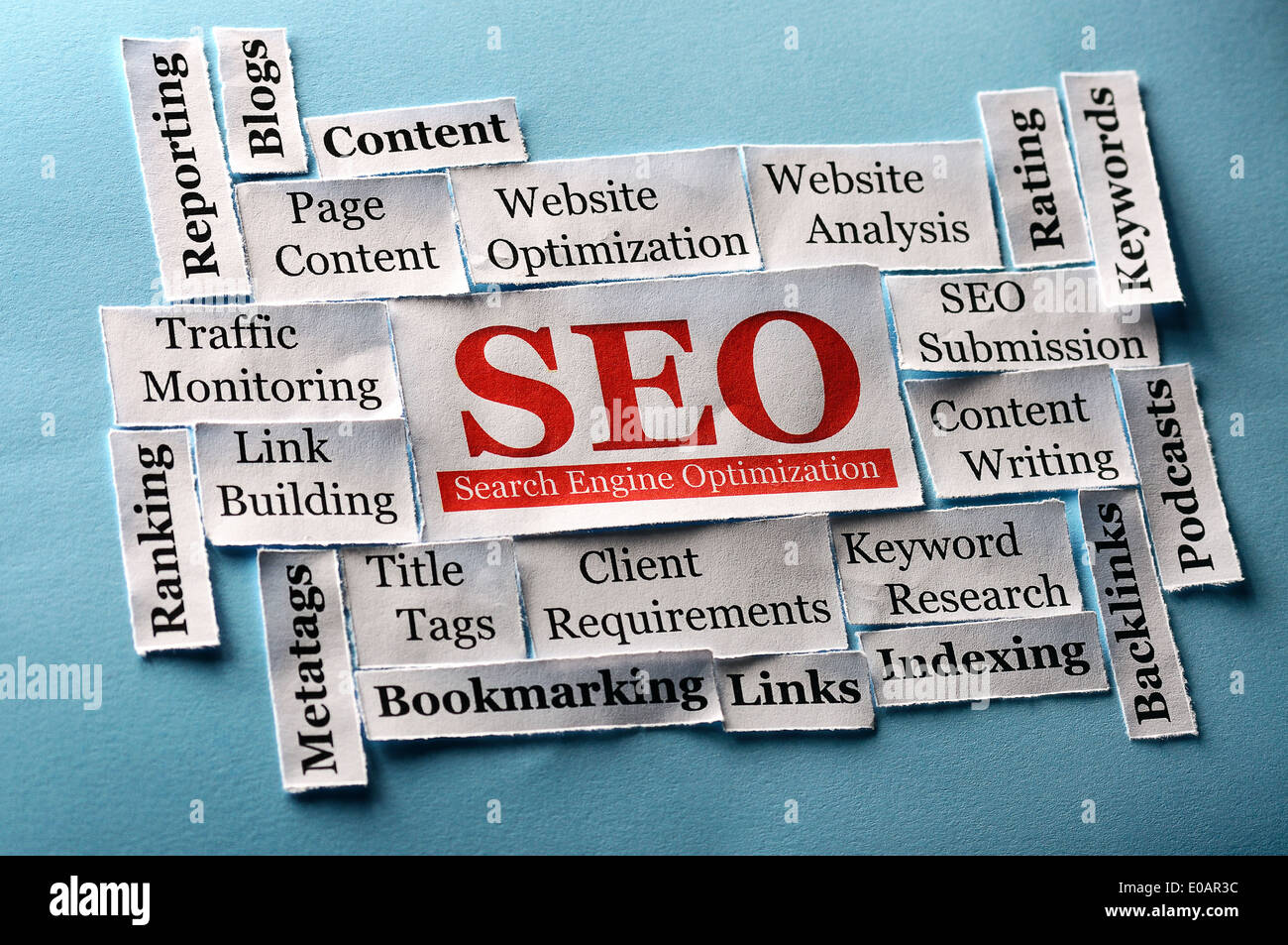 SEO Word Cloud printed on paper on blue font Stock Photo - Alamy