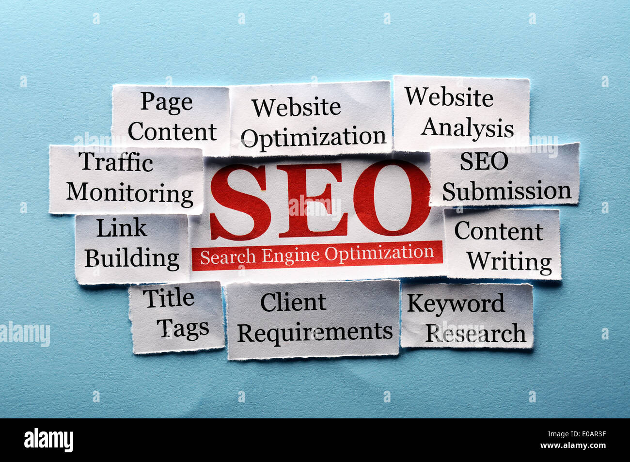 SEO Word Cloud printed on paper on blue font Stock Photo - Alamy
