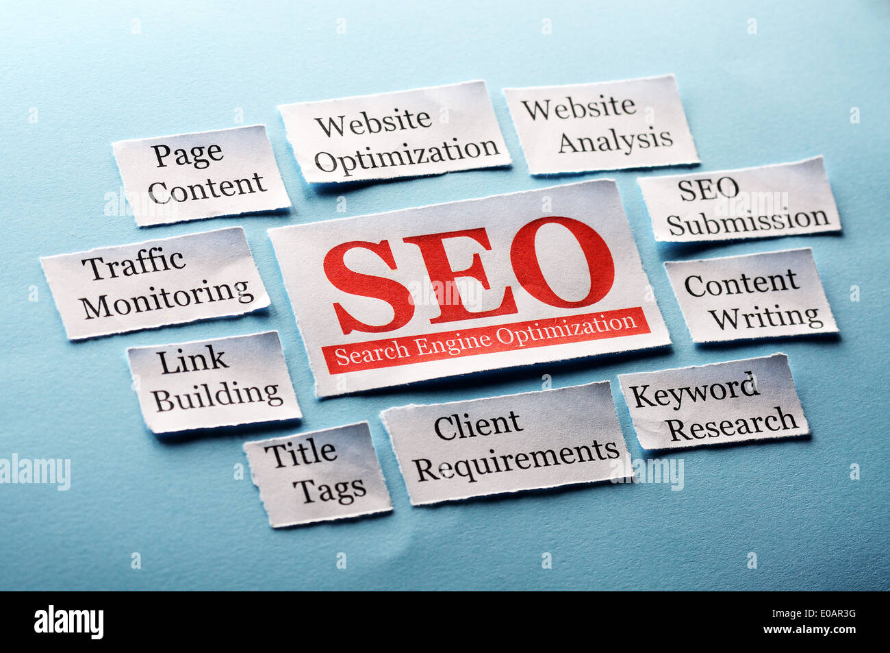 SEO Word Cloud printed on paper on blue font Stock Photo - Alamy