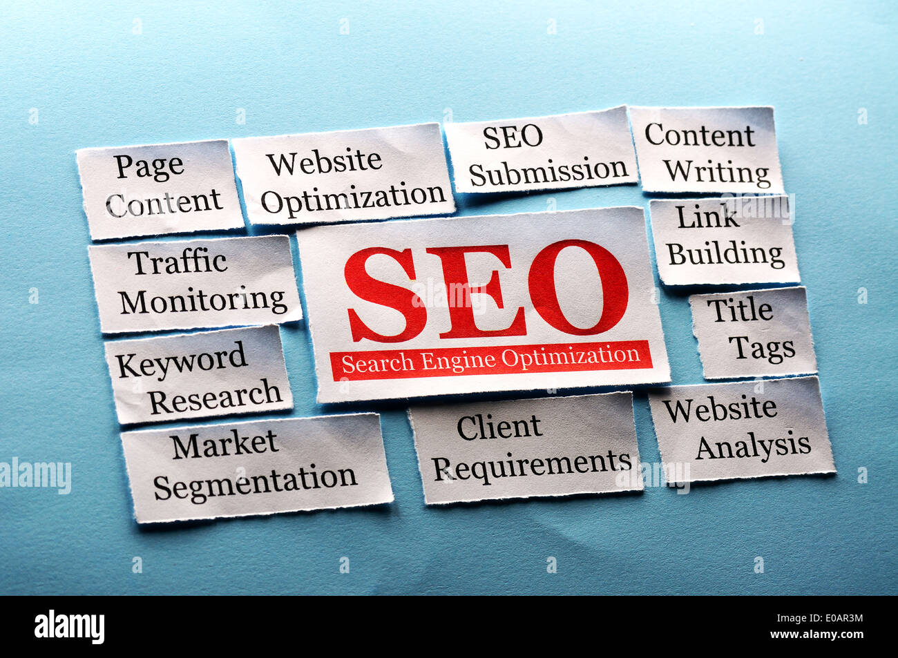SEO Word Cloud printed on paper on blue font Stock Photo - Alamy