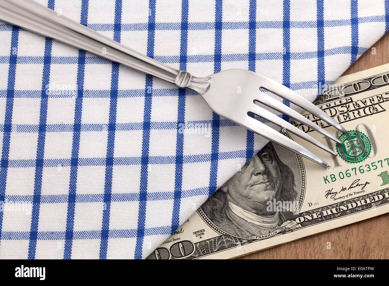 Fork with money for food business concept Stock Photo - Alamy