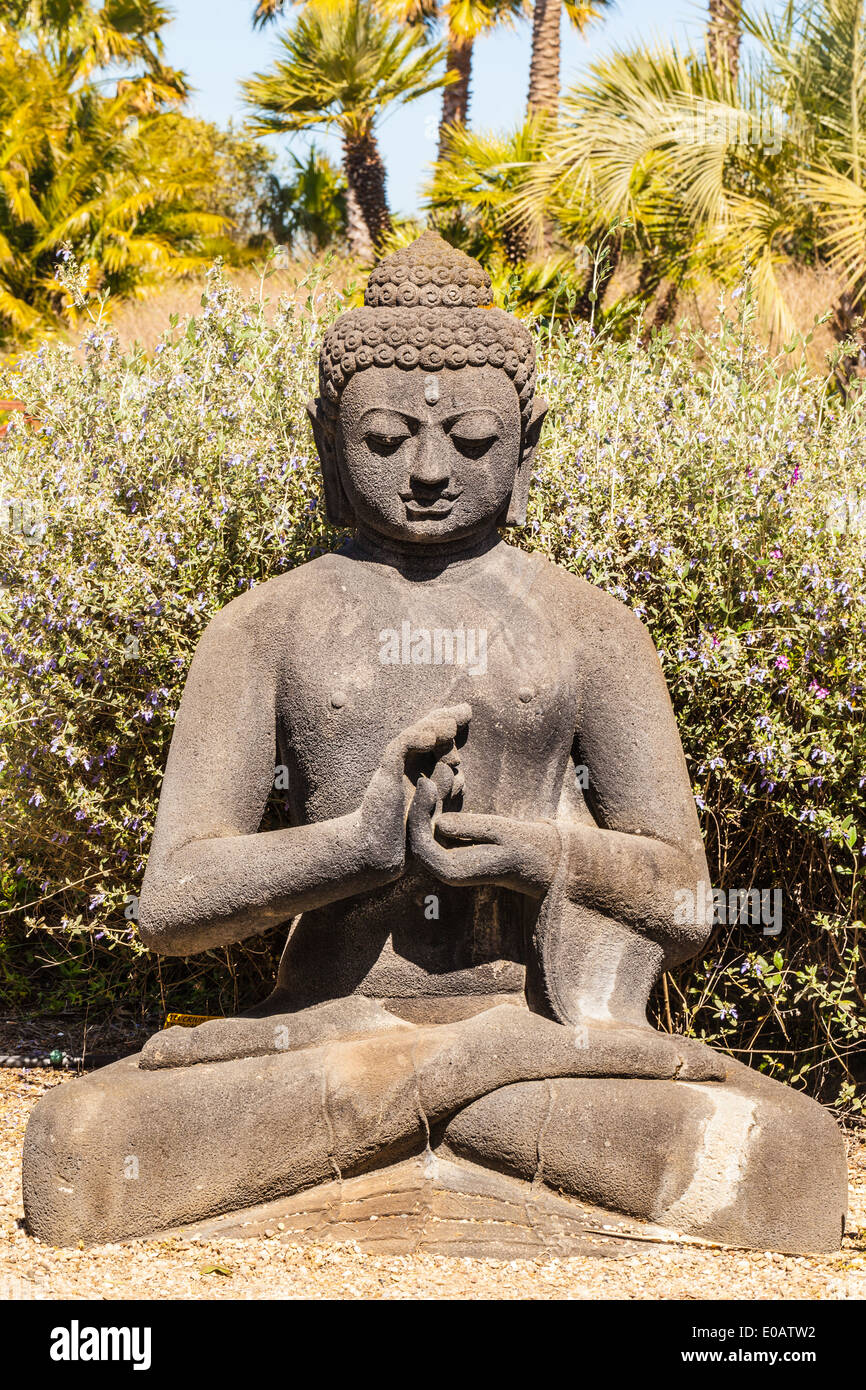 an ancient Buddhist stone sculpture in a beautiful garden Stock Photo ...