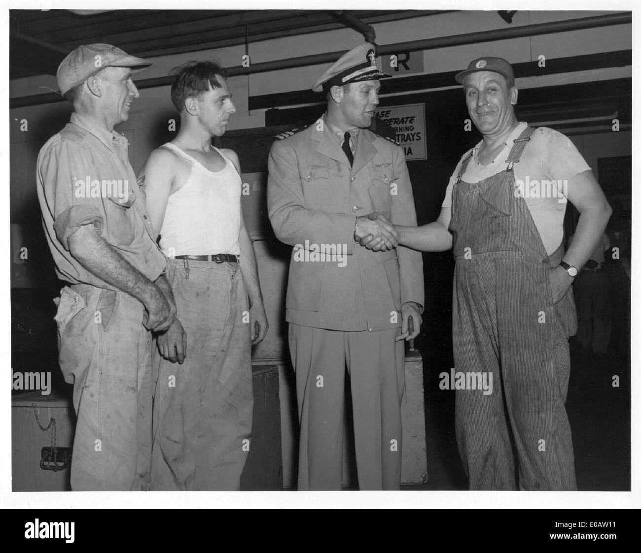 This photo, labeled Fisher015, captures a handshake between Harold ...