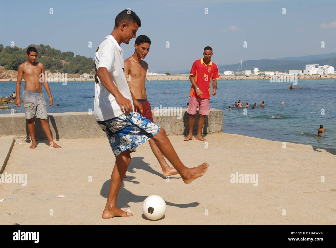 Tunisia, young people play soccer on waterfront of Tabarka town Stock ...