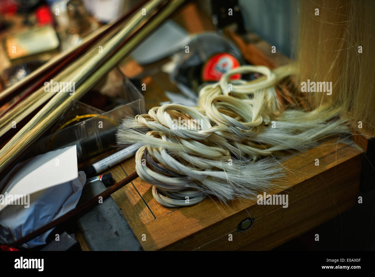 Tools and horsehair for the bows in a violin maker's workshop Stock ...