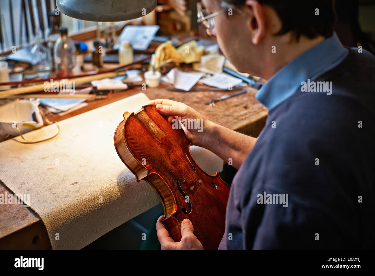 Violin maker at work in his workshop Stock Photo - Alamy