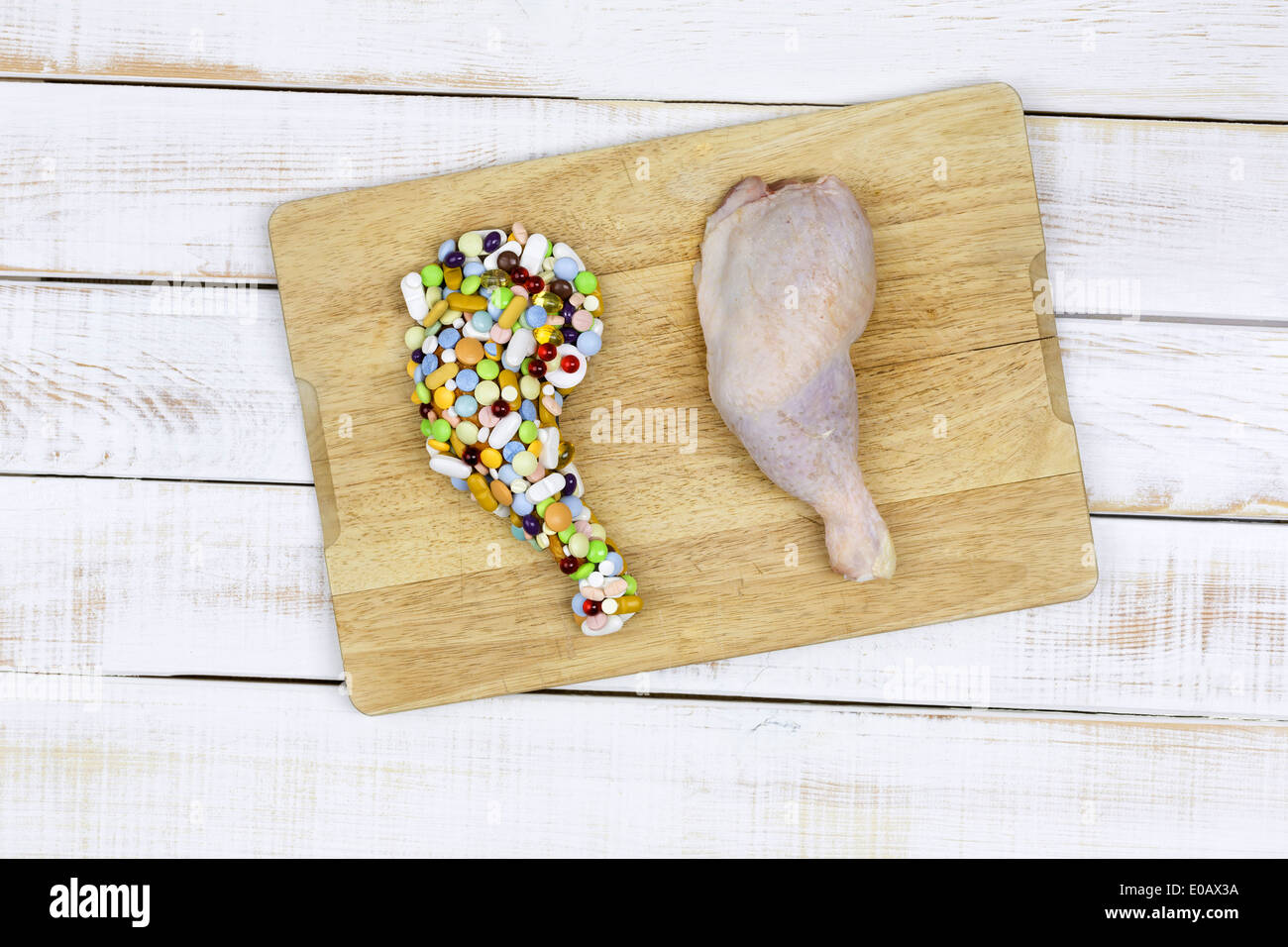 Chicken leg shaped from tablets, next to normal chicken leg Stock Photo ...