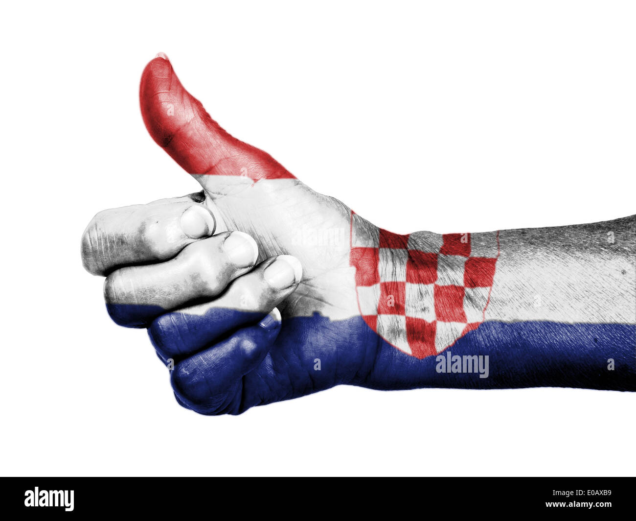 Old woman with arthritis giving the thumbs up sign wrapped in flag ...