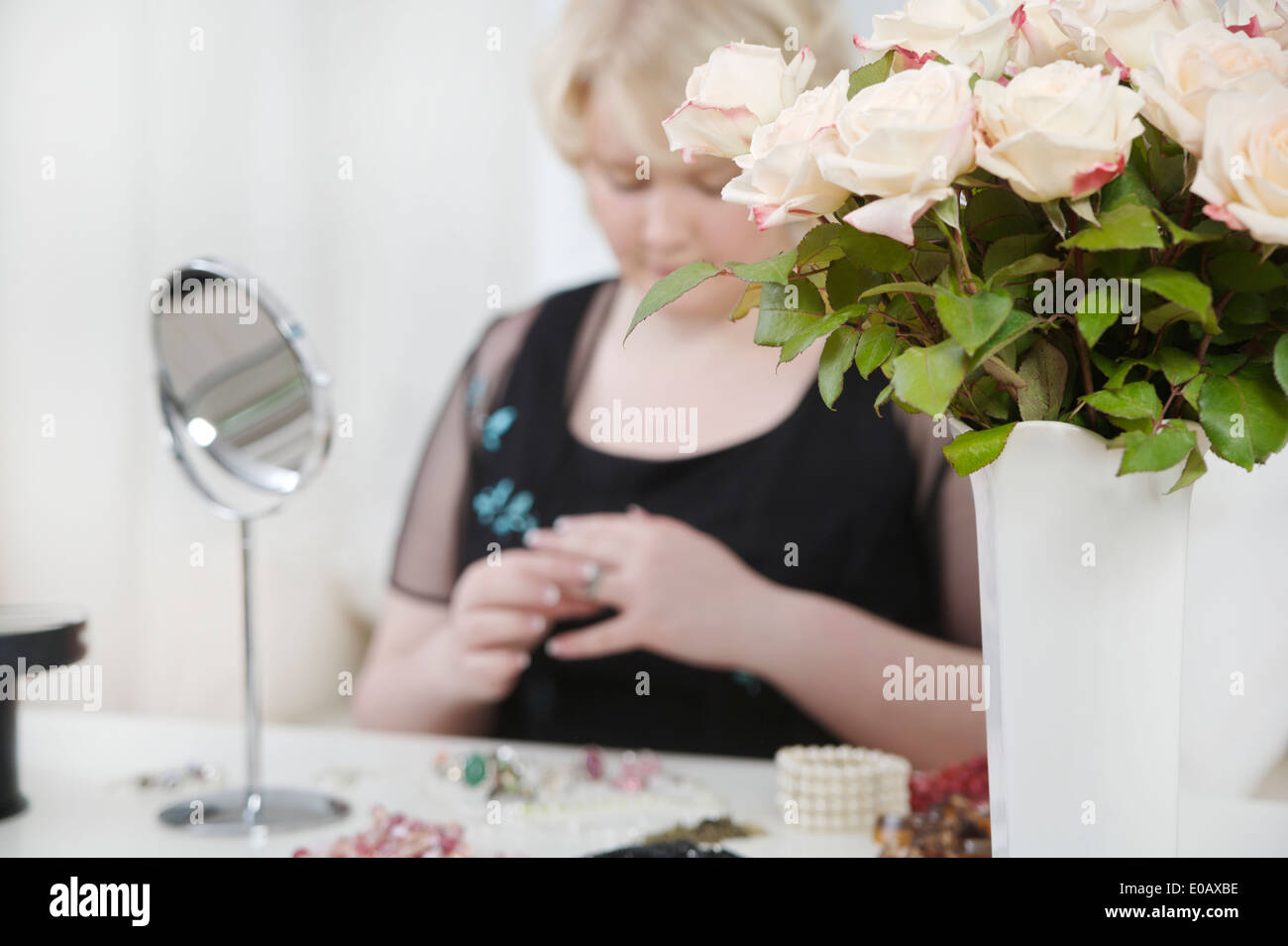 Bunch of roses and woman putting on ring Stock Photo - Alamy
