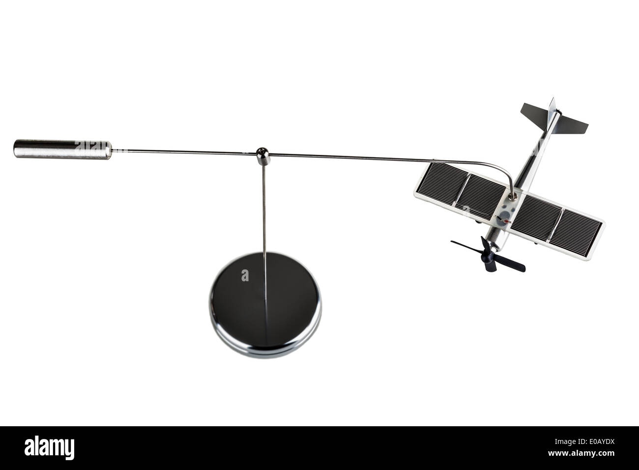 a metal toy plane with solar panels isolated over a white background ...