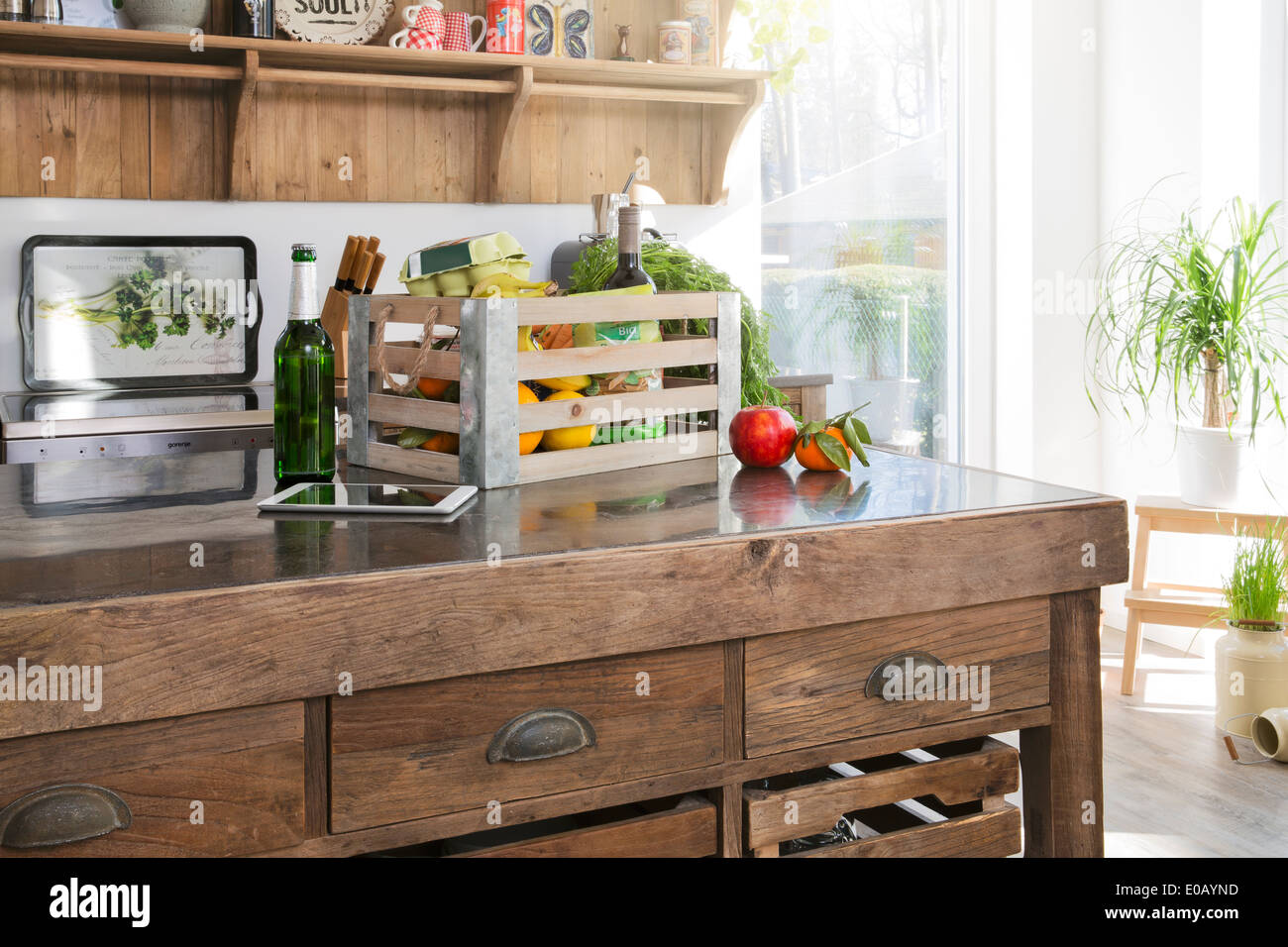 Crate of groceries in country style kitchen Stock Photo - Alamy
