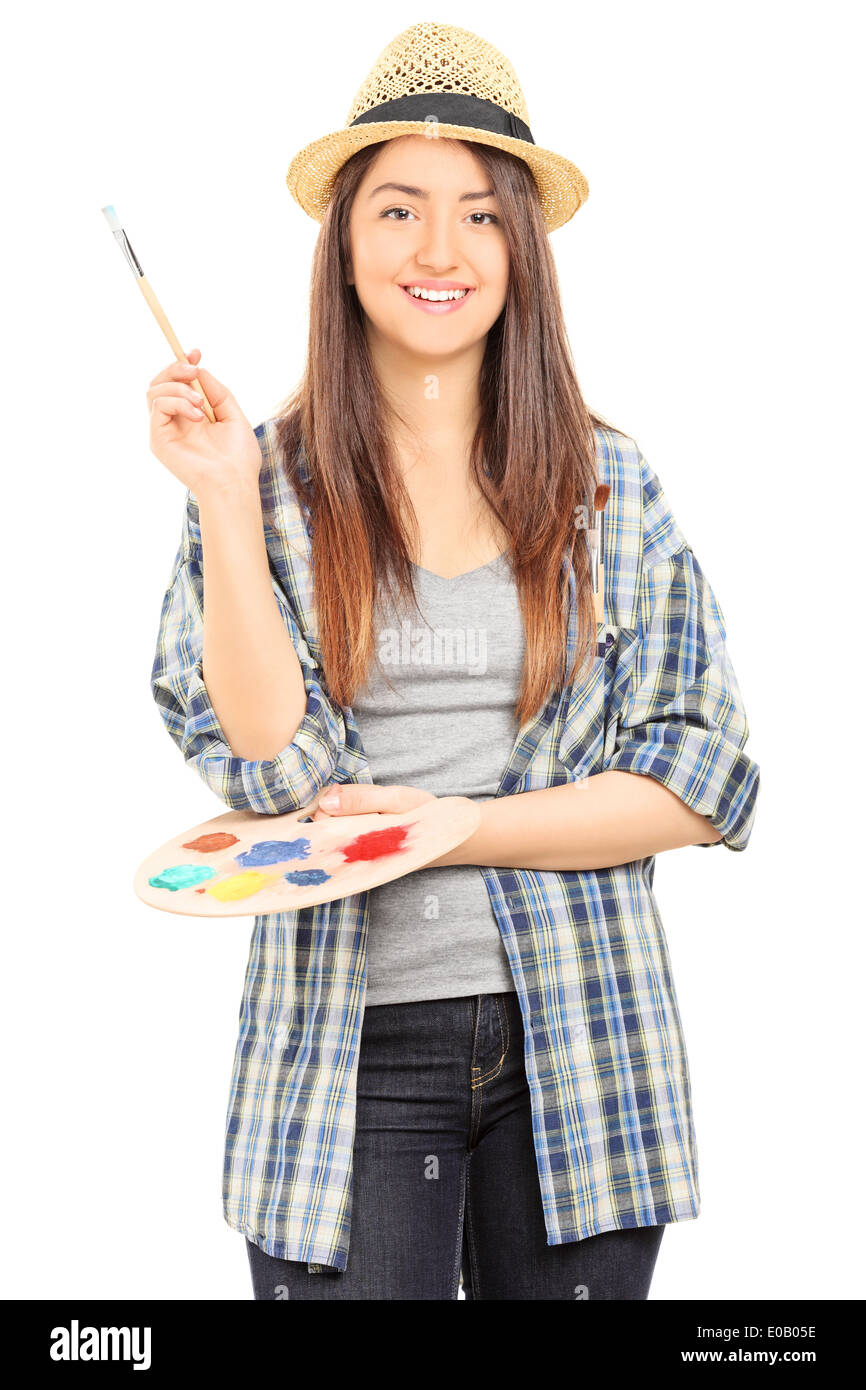 Beautiful female artist holding a paintbrush Stock Photo - Alamy