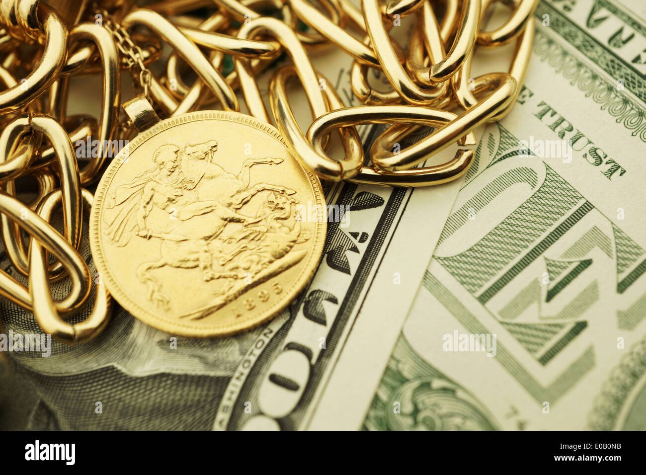 Gold coin with jewellery and dollar bills Stock Photo - Alamy