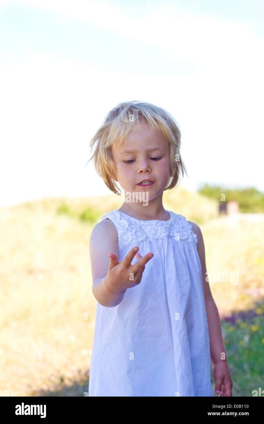 Little girl counting with fingers Stock Photo - Alamy