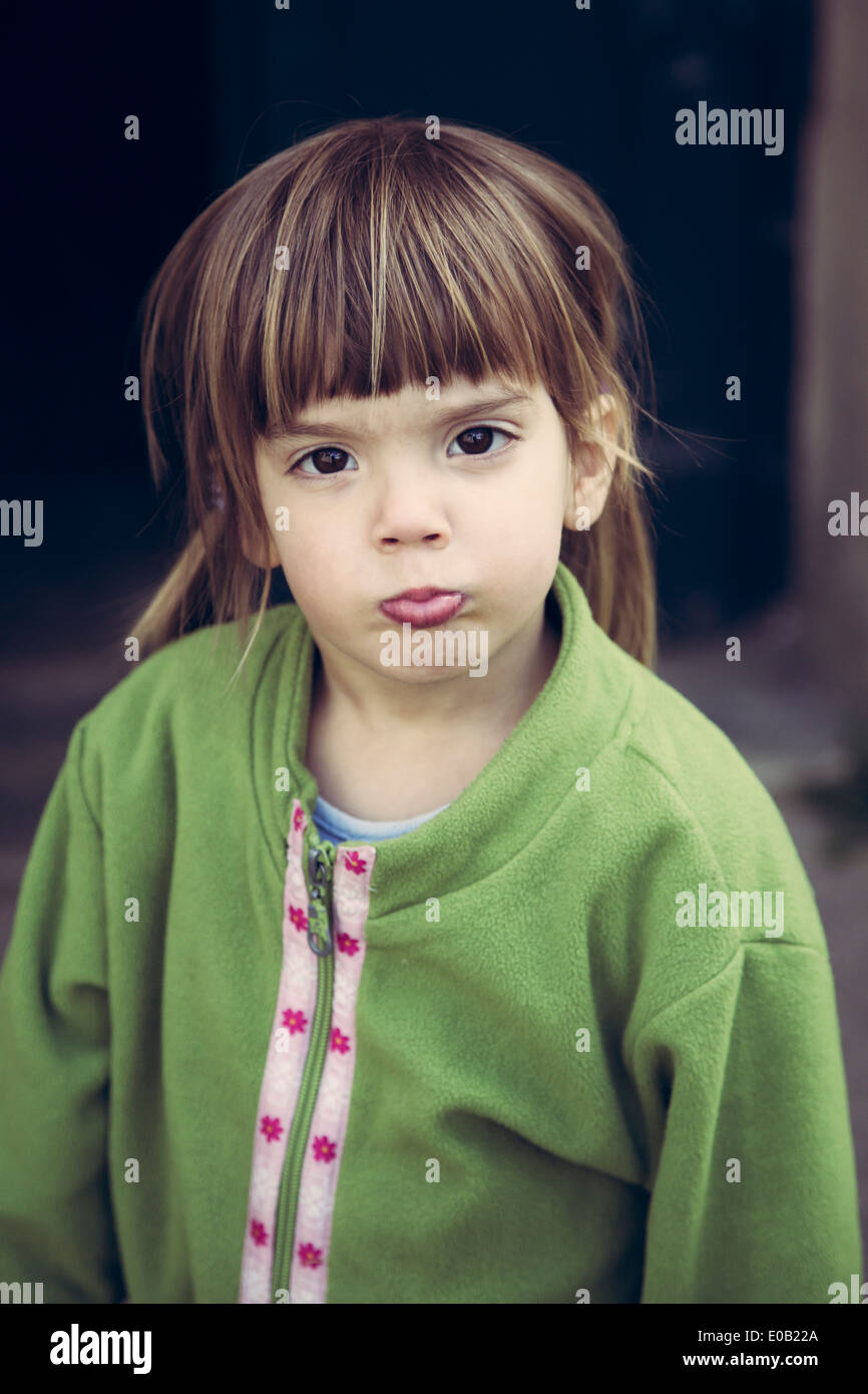 Portrait of little girl pouting mouth Stock Photo - Alamy