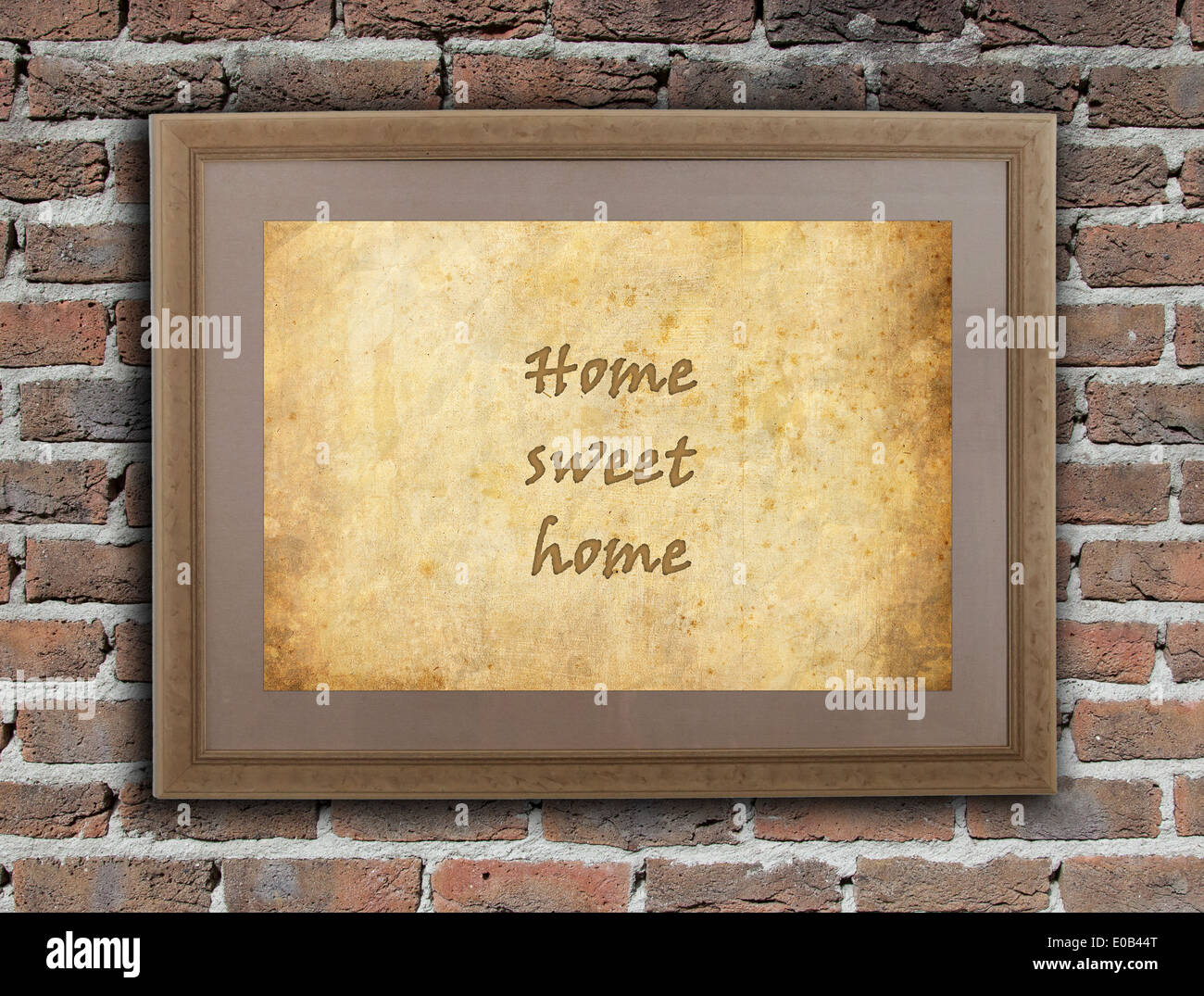 Old wooden frame with written text on an old wall - Home sweet home ...