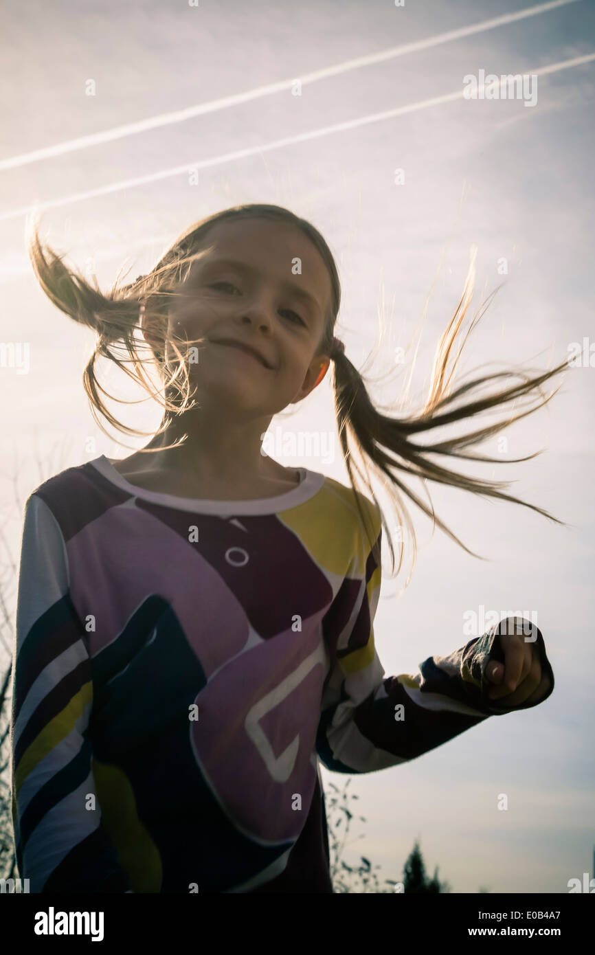 Portrait of little girl playing with Moon Hopper Stock Photo - Alamy