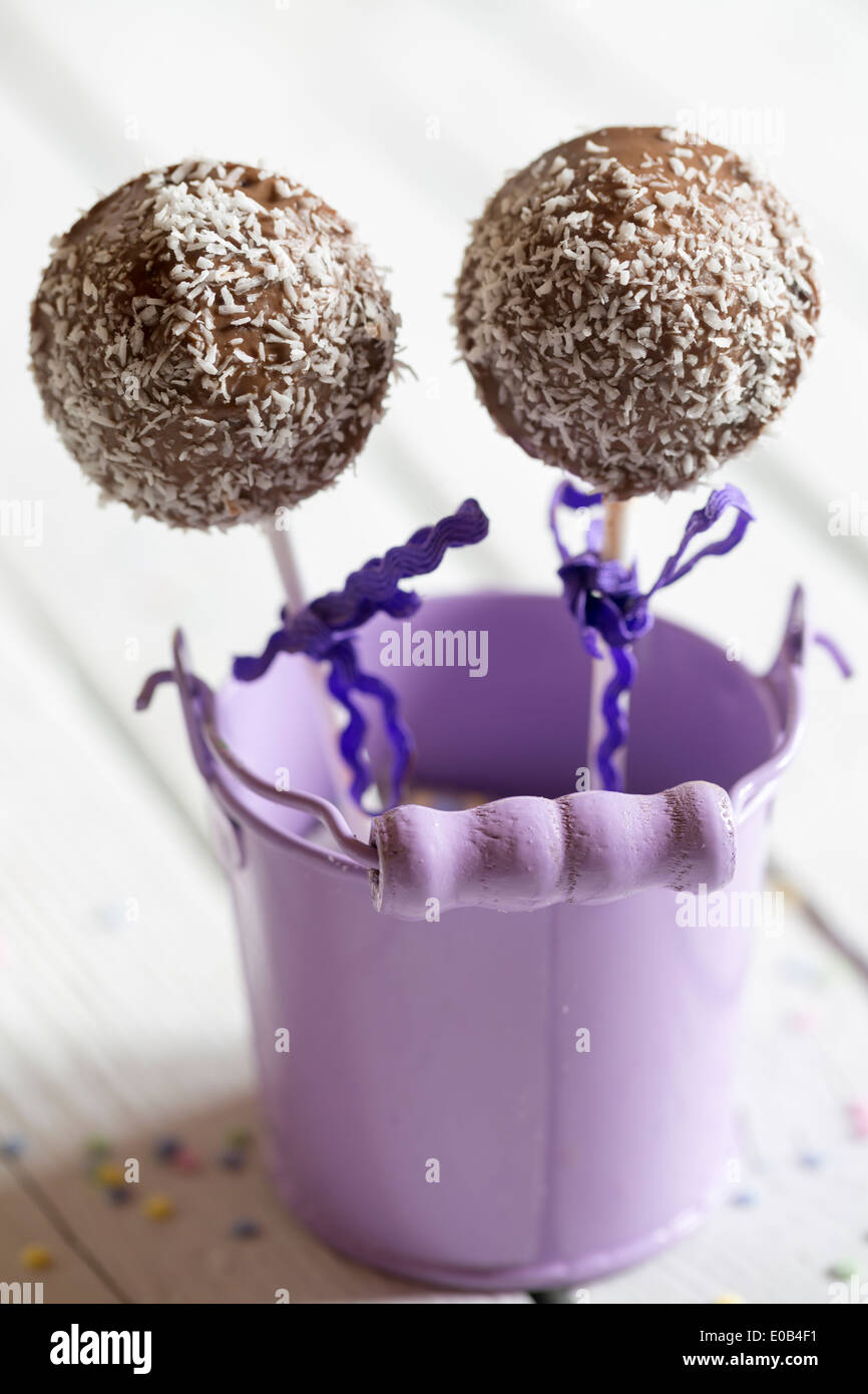 Pail with two cake pops on white ground Stock Photo - Alamy