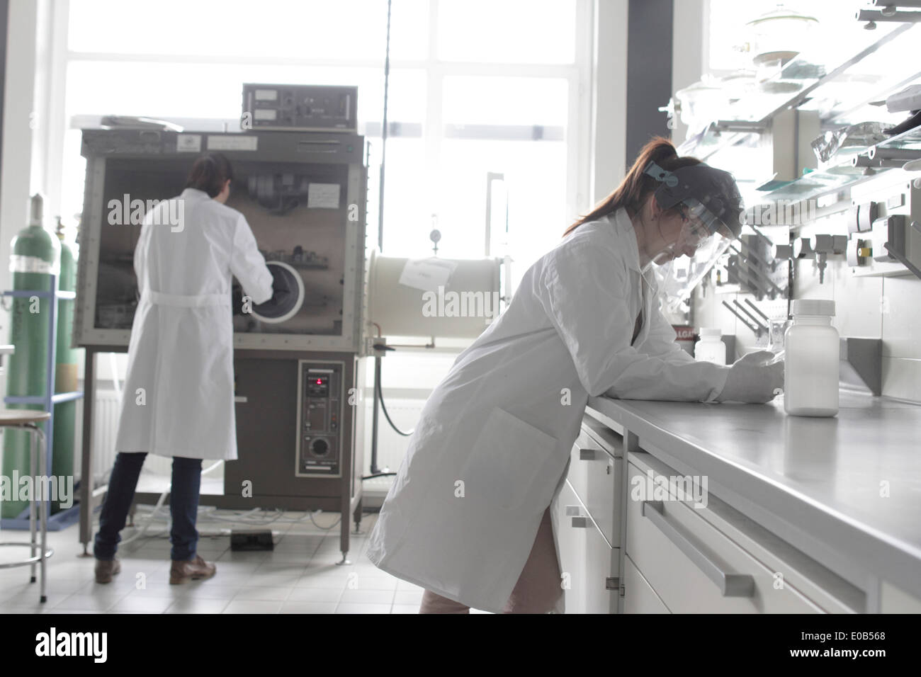 Two young female chemistry students in lab Stock Photo - Alamy