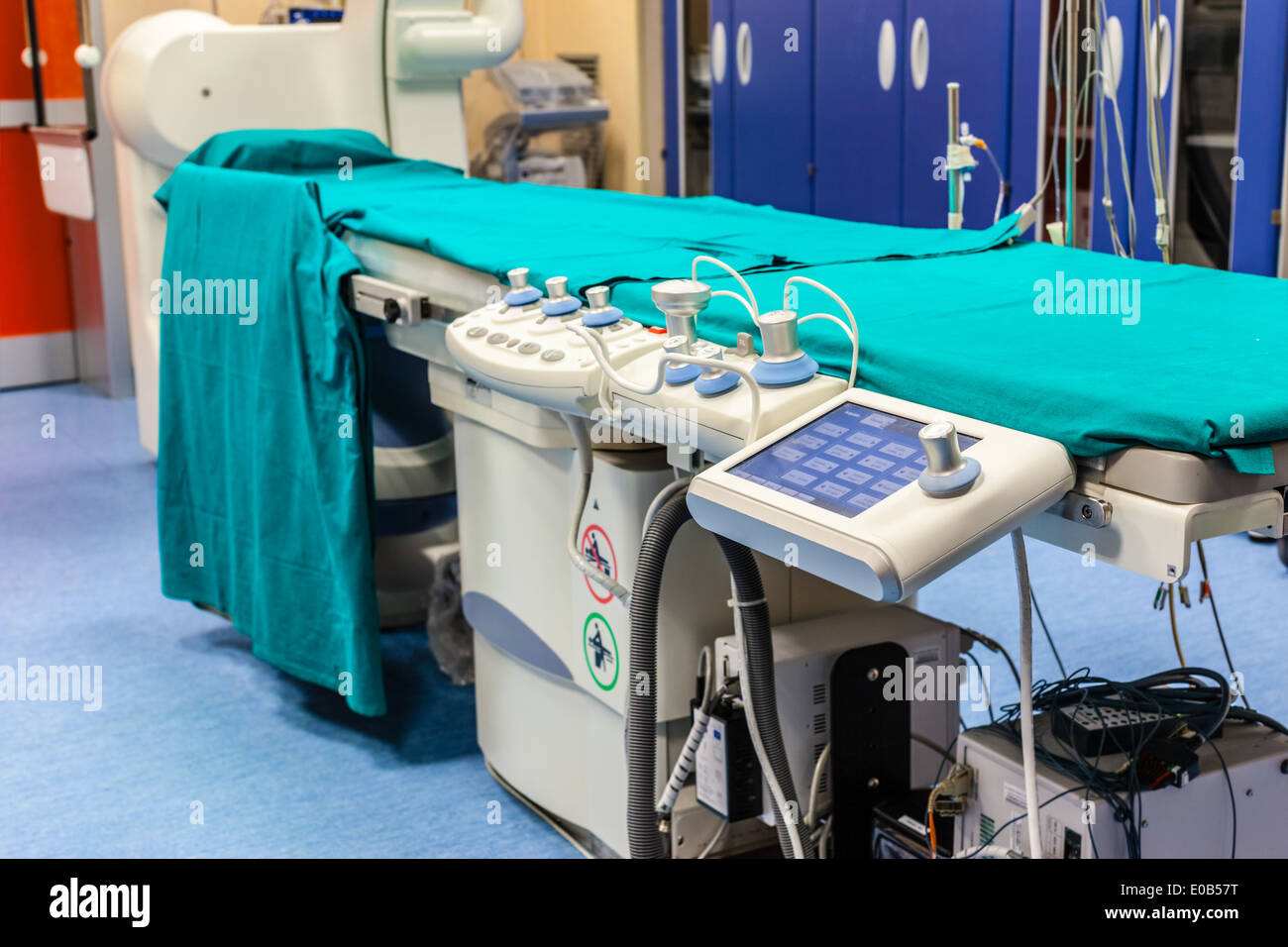 a surgical table in an operatory room with various medical equipment ...