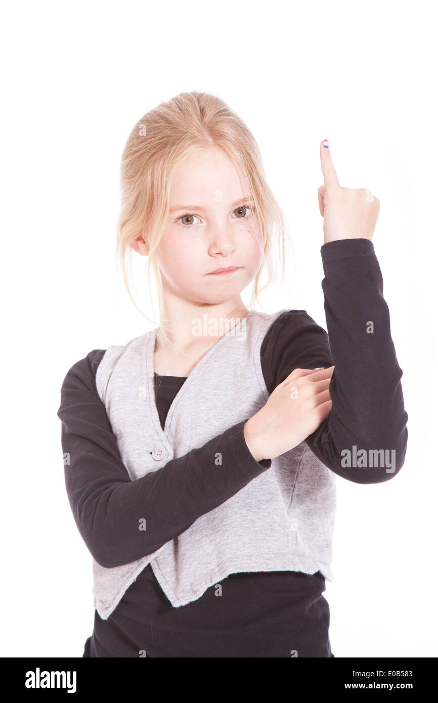 young blond girl giving the finger in studio against white background ...
