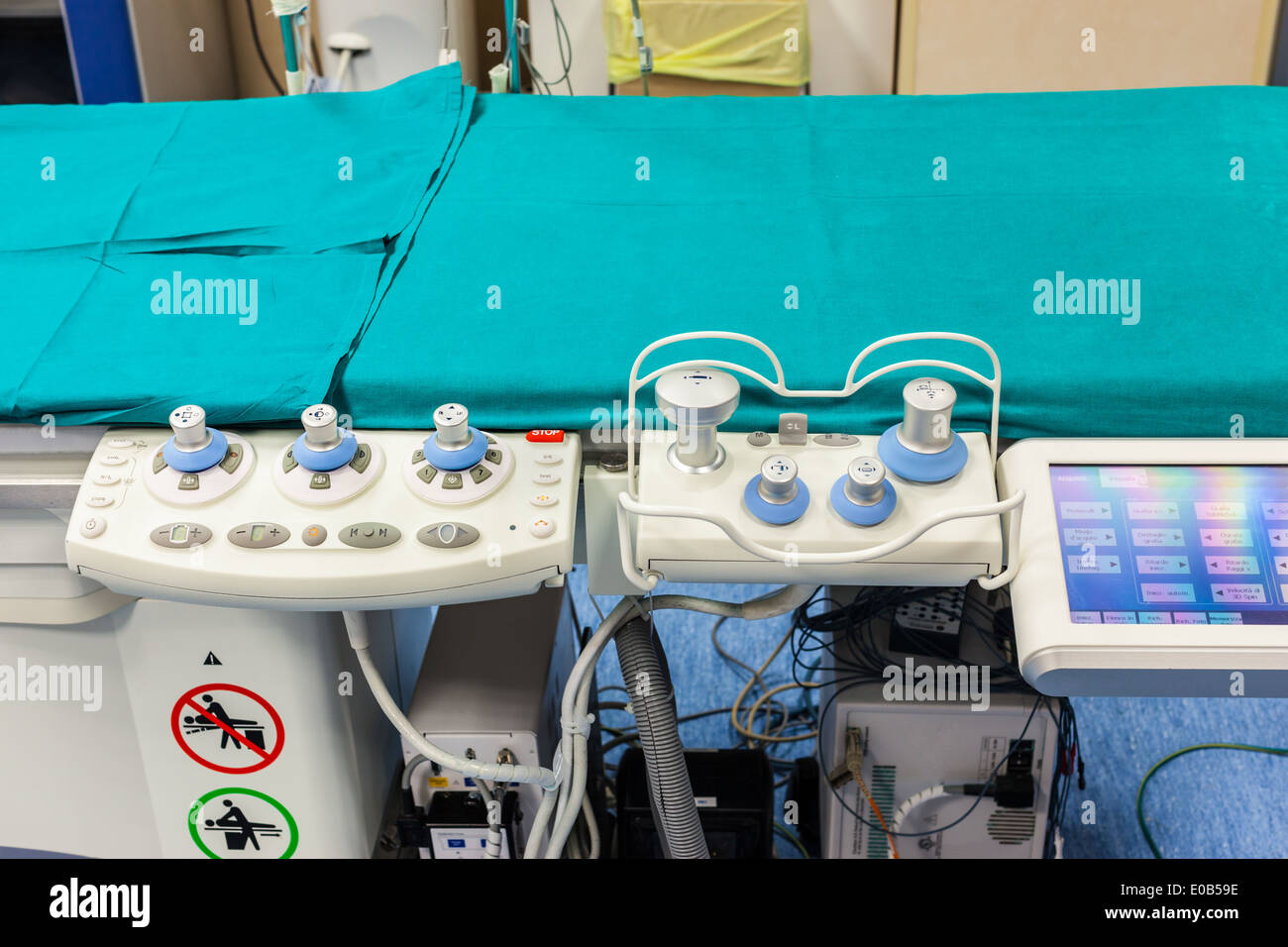a surgical table in an operatory room with various medical equipment ...