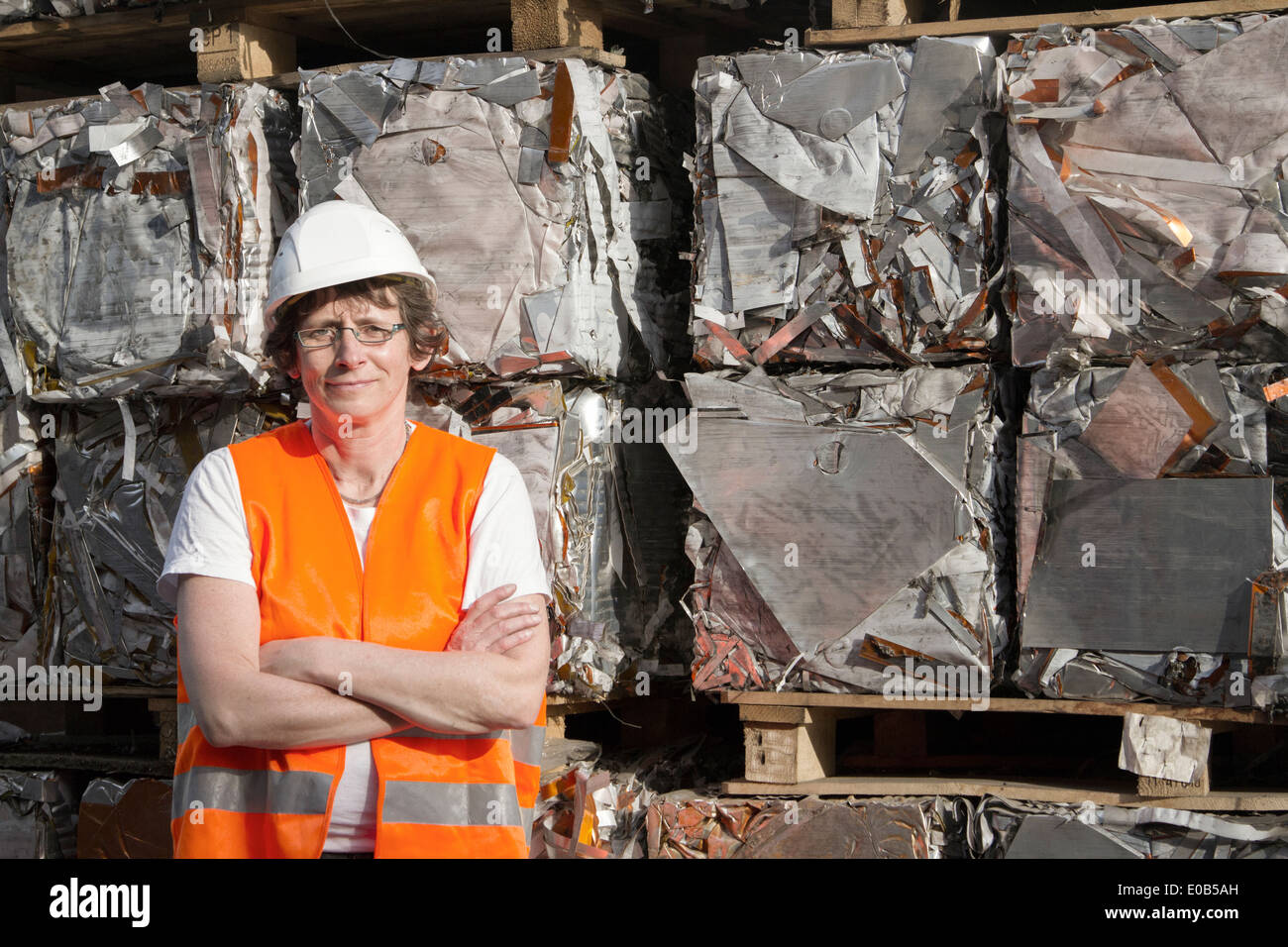 Portrait of female technician at recycling yard of aluminium Stock ...