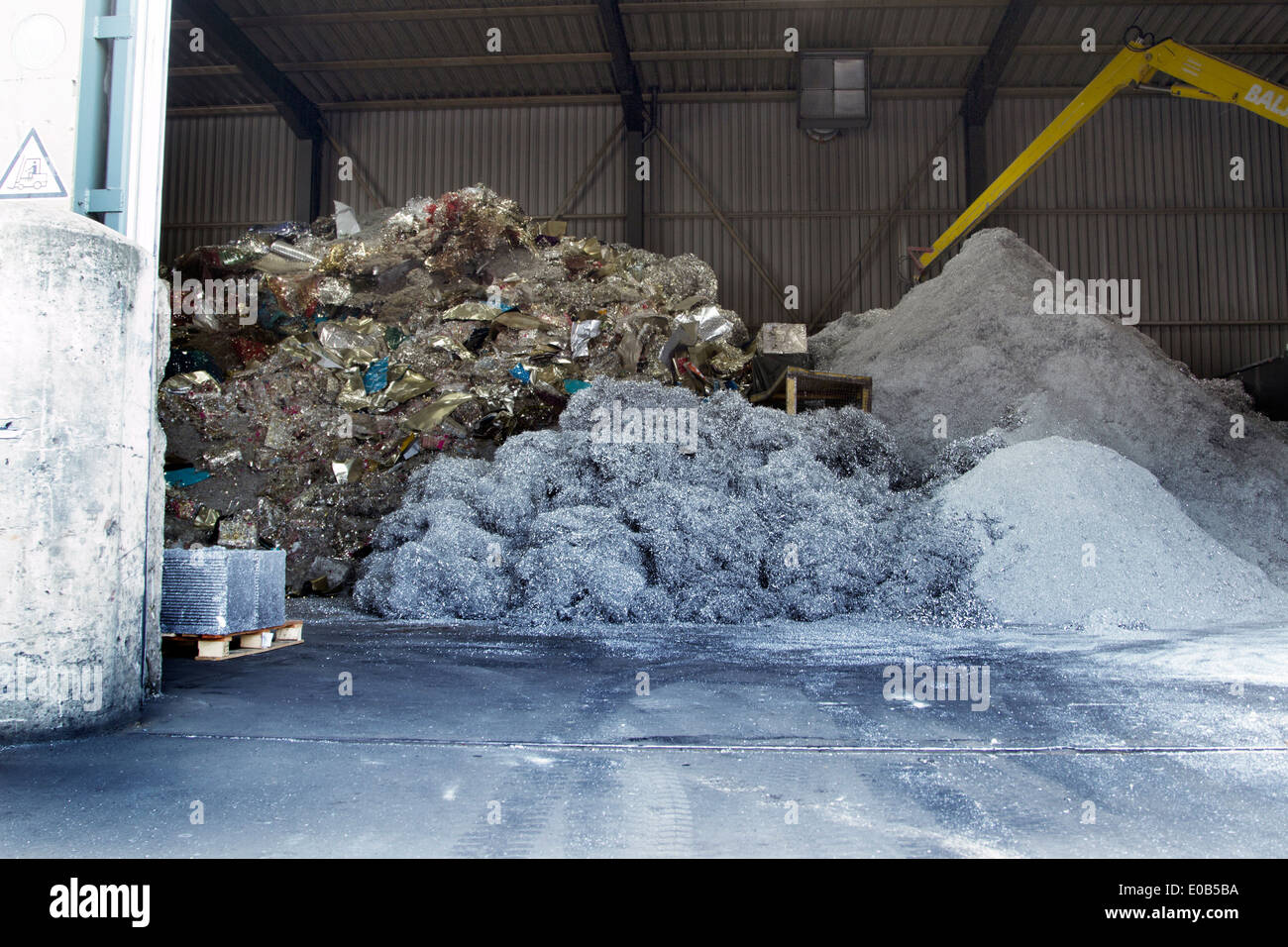 Piles of different materials in industrial hall at recycling yard Stock ...