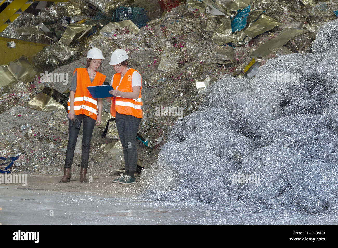 Two female technicians at recycling yard of aluminium Stock Photo - Alamy