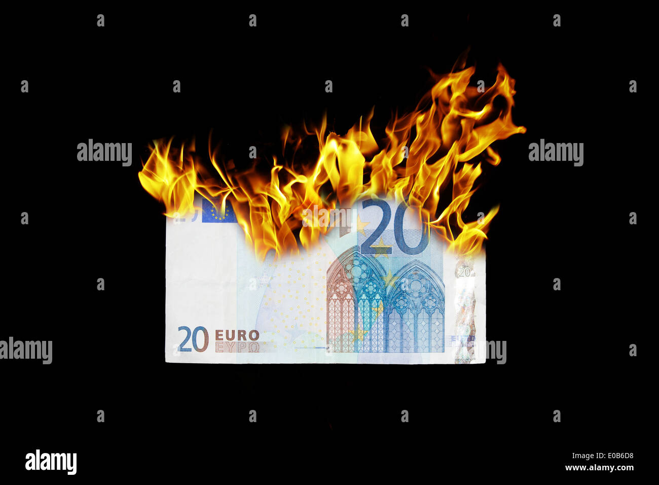 Burning money euro bill on fire isolated on black Stock Photo - Alamy
