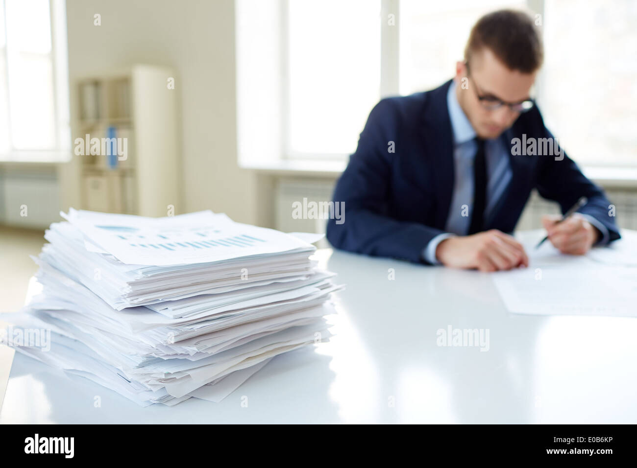 Young guy working documents workplace hi-res stock photography and ...