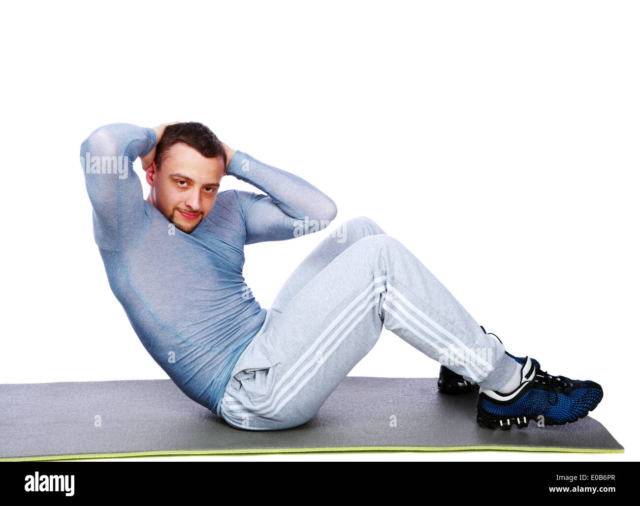 Sportsman on abdominals rotation workout posture over white background ...