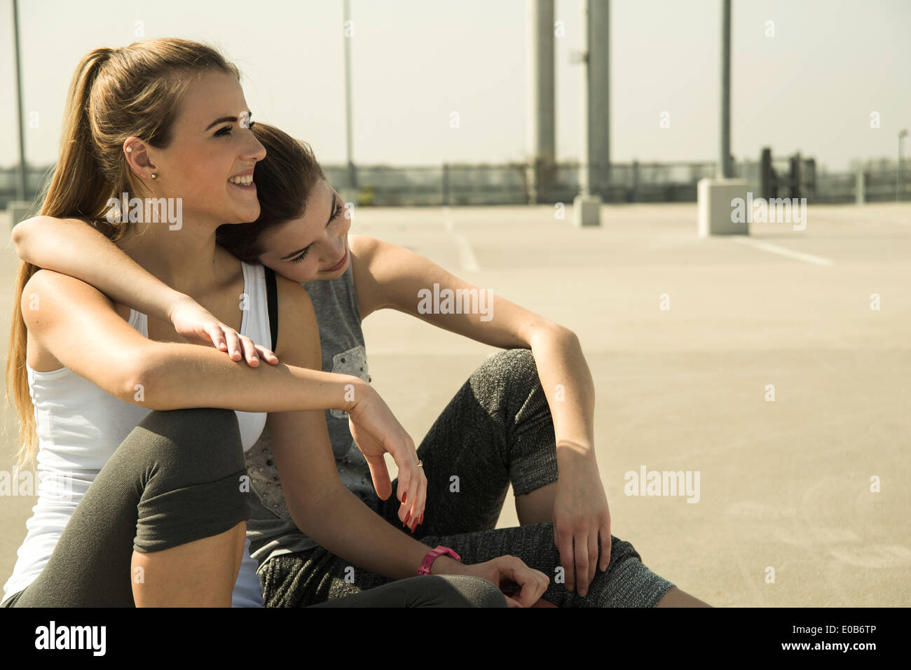 Two happy friends embracing outdoors Stock Photo - Alamy