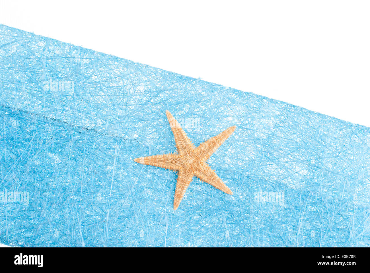 Blue envelope made of blue straw mesh with sea star decoration on white ...
