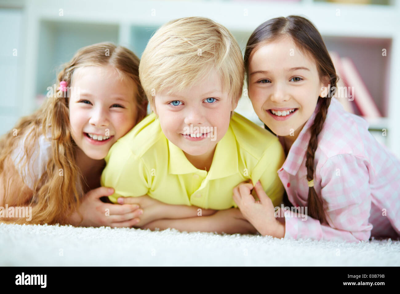 Three little friends looking at camera with smiles Stock Photo - Alamy