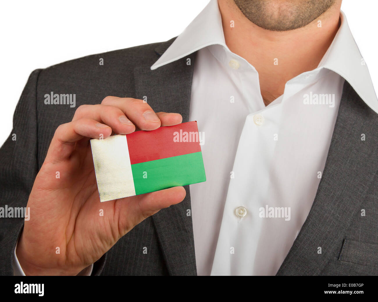 Businessman is holding a business card flag of Madagascar Stock Photo ...