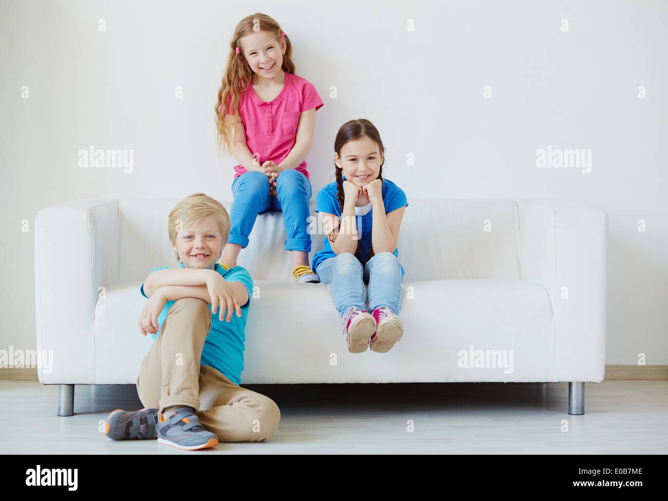 Three little friends looking at camera with smiles Stock Photo - Alamy