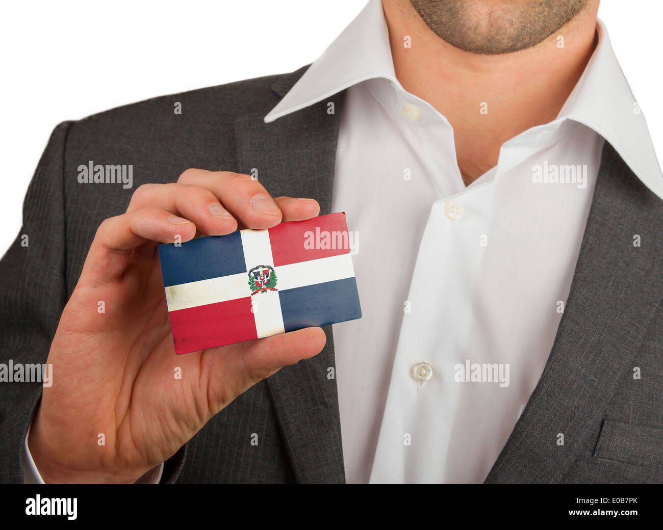 Businessman is holding a business card flag of The Dominican Republic ...
