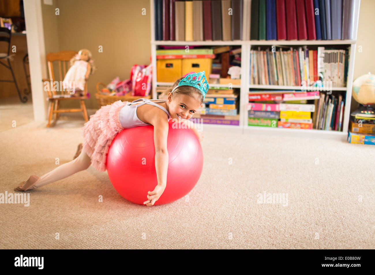 Portrait of cute young girl on top of exercise ball Stock Photo - Alamy