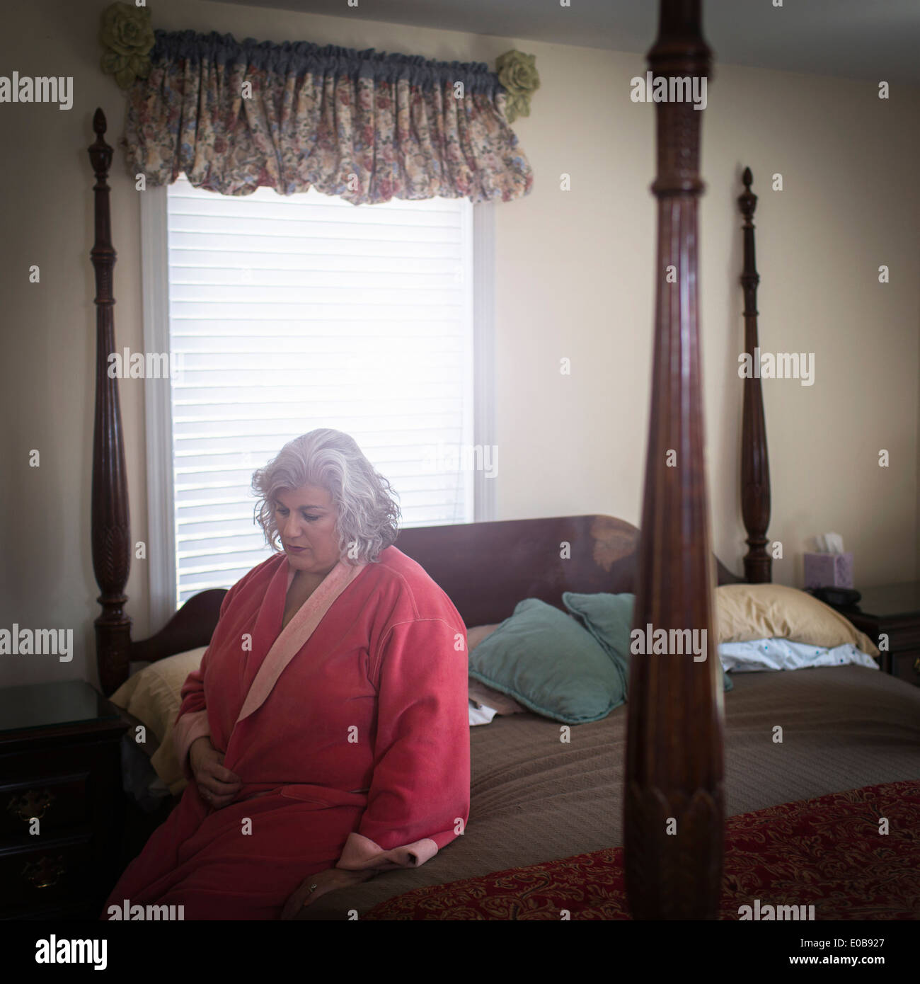 Woman sitting on the bed edge hi-res stock photography and images - Alamy