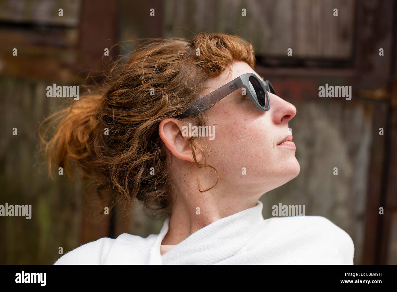 Woman looking over the top of her glasses hi-res stock photography and ...