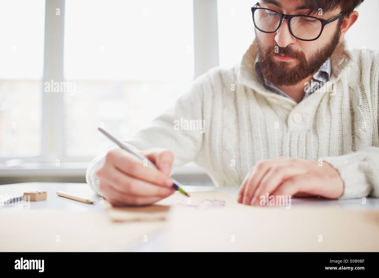 Image of bearded young man drawing Stock Photo - Alamy