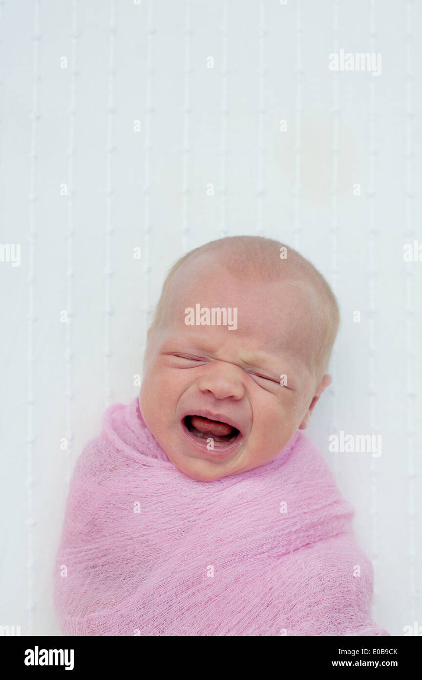 Baby Crying Wrapped In Blanket High Resolution Stock Photography and ...