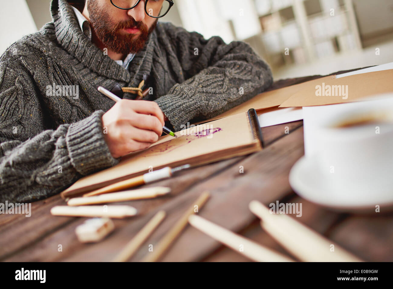 Image of young bearded man drawing Stock Photo - Alamy