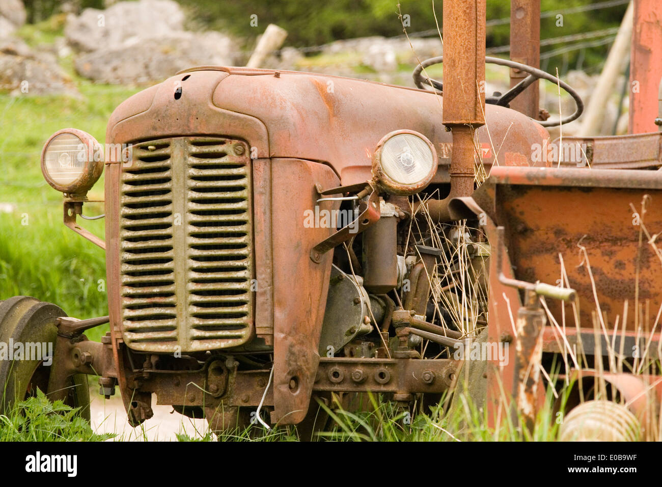 Overgrown old farm equipment hi-res stock photography and images - Alamy