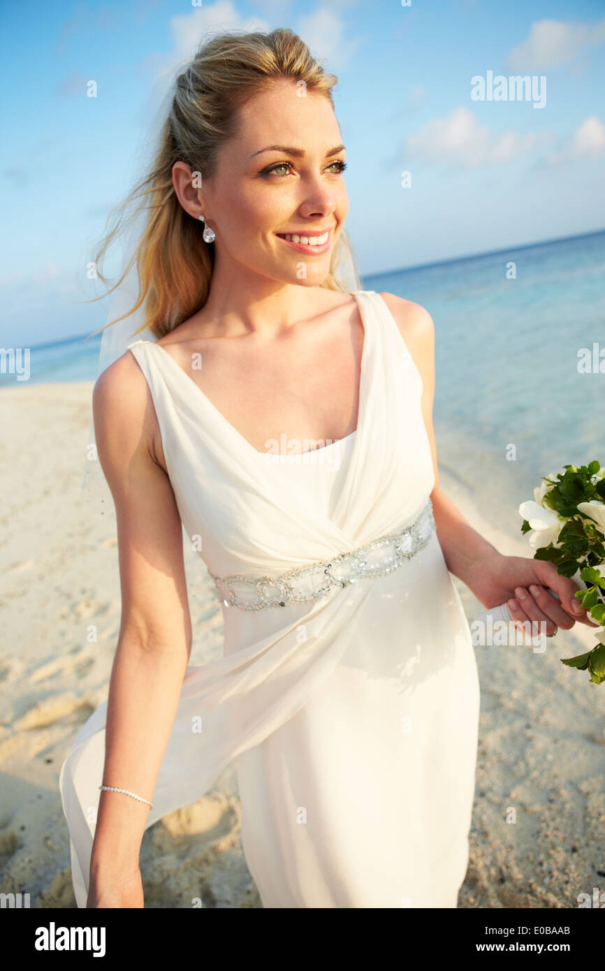 Beautiful Bride Getting Married In Beach Ceremony Stock Photo - Alamy
