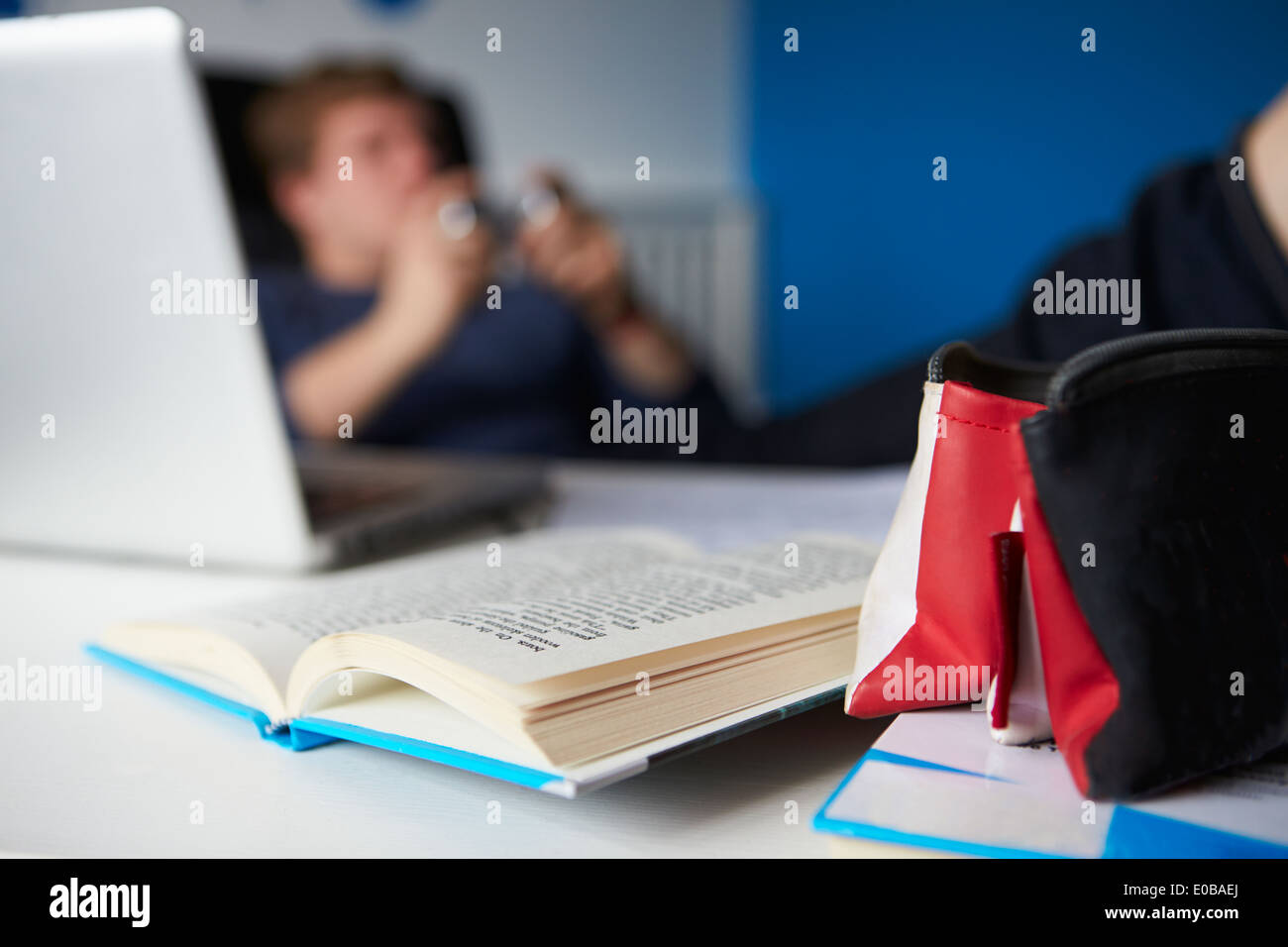 Teenage Boy Playing Video Game Instead Of Studying Stock Photo - Alamy Teenage Boy Playing Video Game Instead Of Studying Stock Photo - Alamy